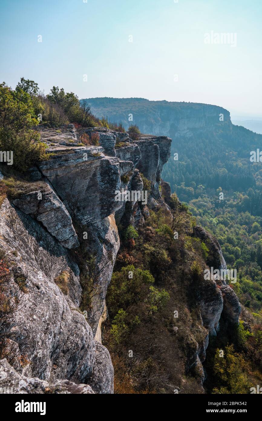 Top View Of Mountain Cliff Rocks with Forest In The Background Stock ...
