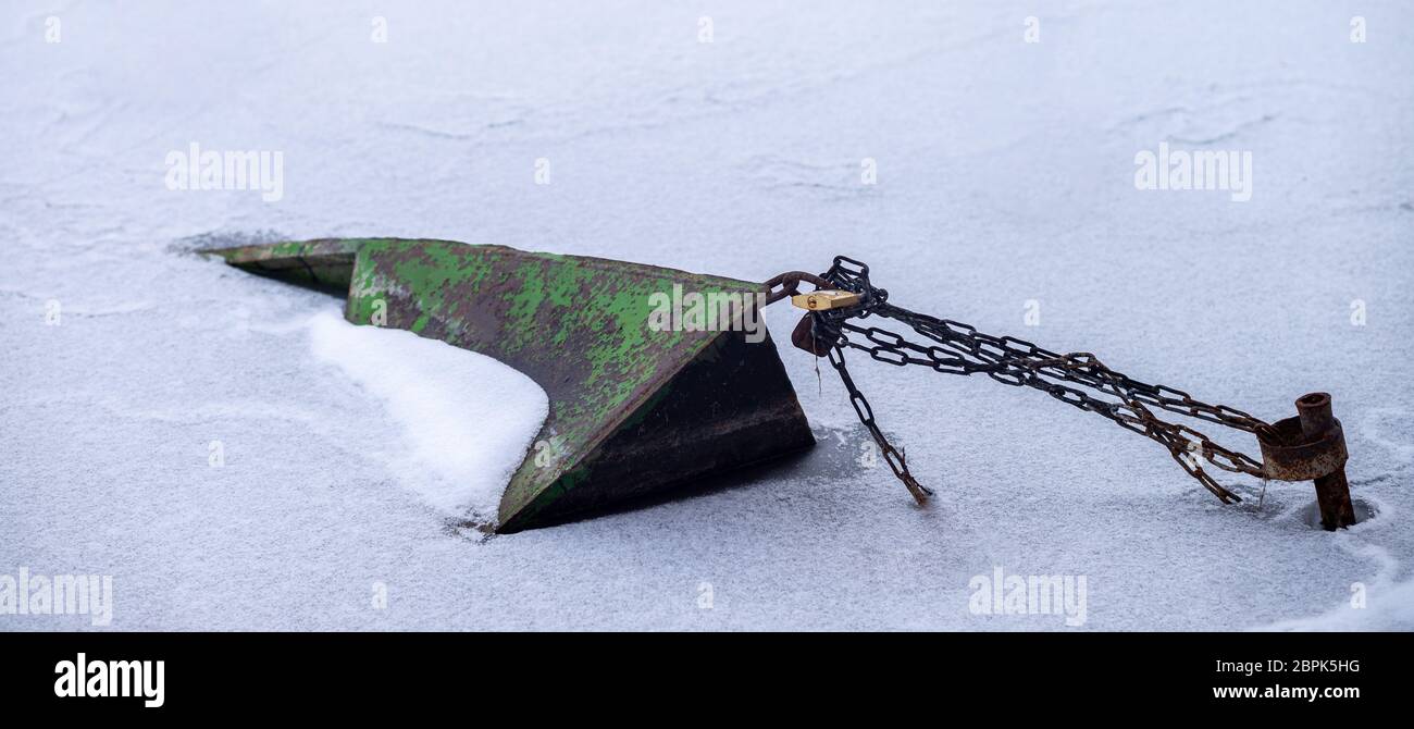 Boat frozen in ice at winter Stock Photo - Alamy