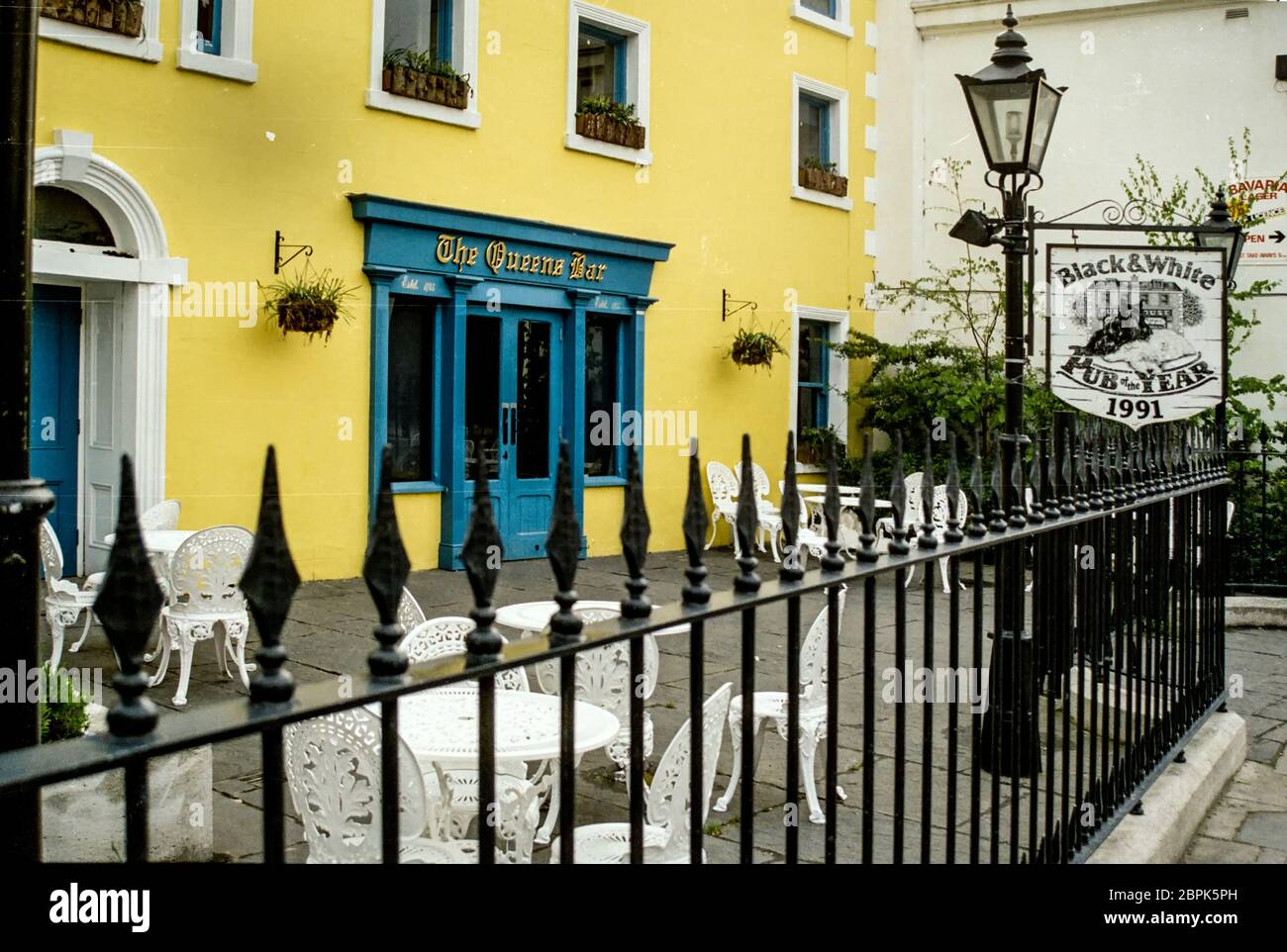 A pub behind the fence Stock Photo - Alamy