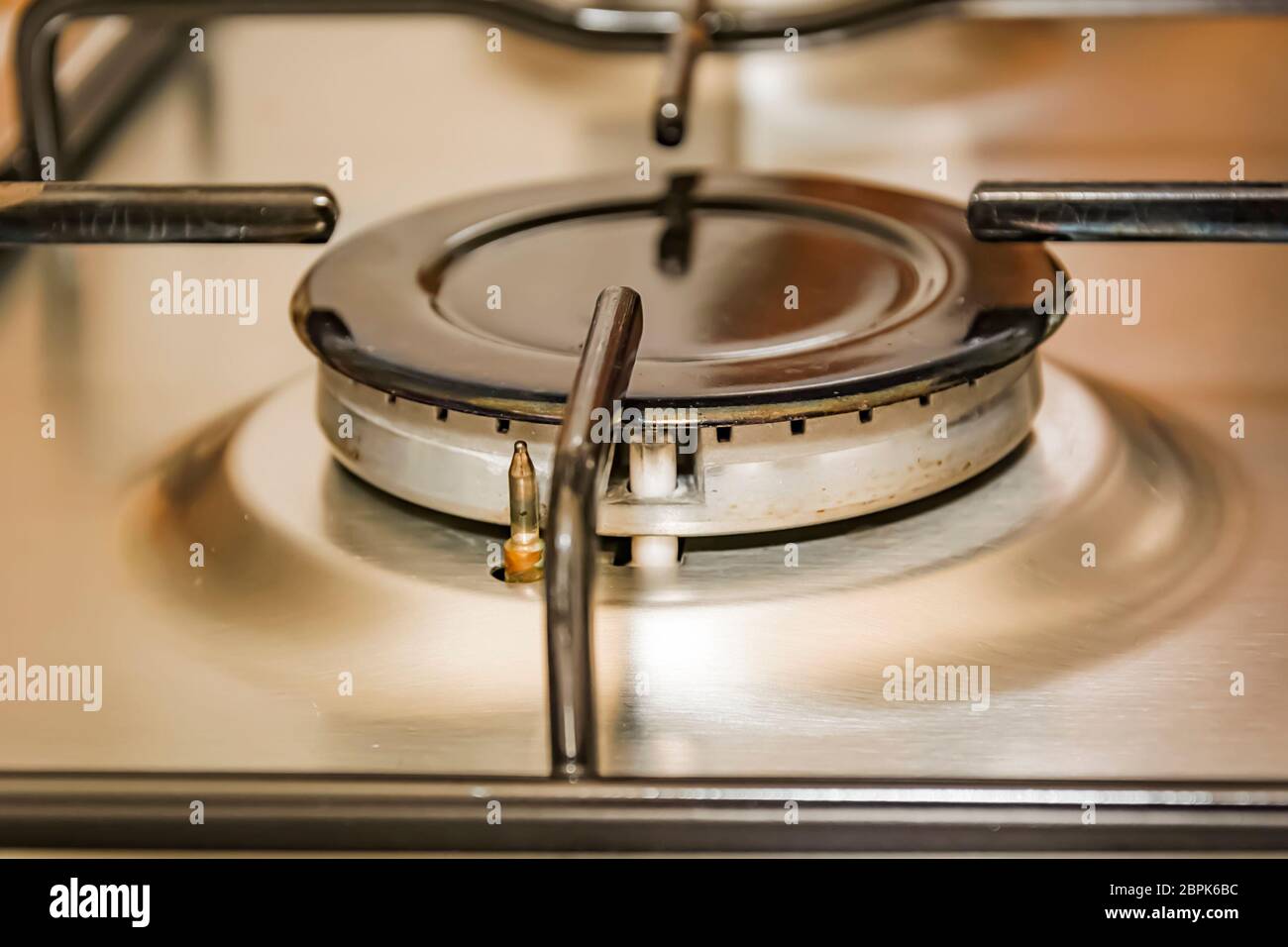 Close-up view of a stove burner in a metal kitchen. interior shot Stock ...
