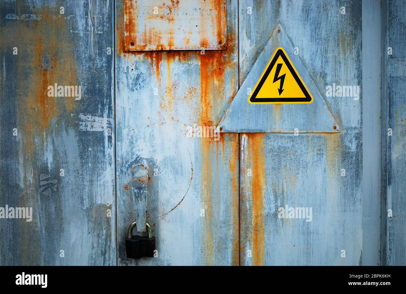 Danger high voltage sign on rusty locked door background Stock Photo ...