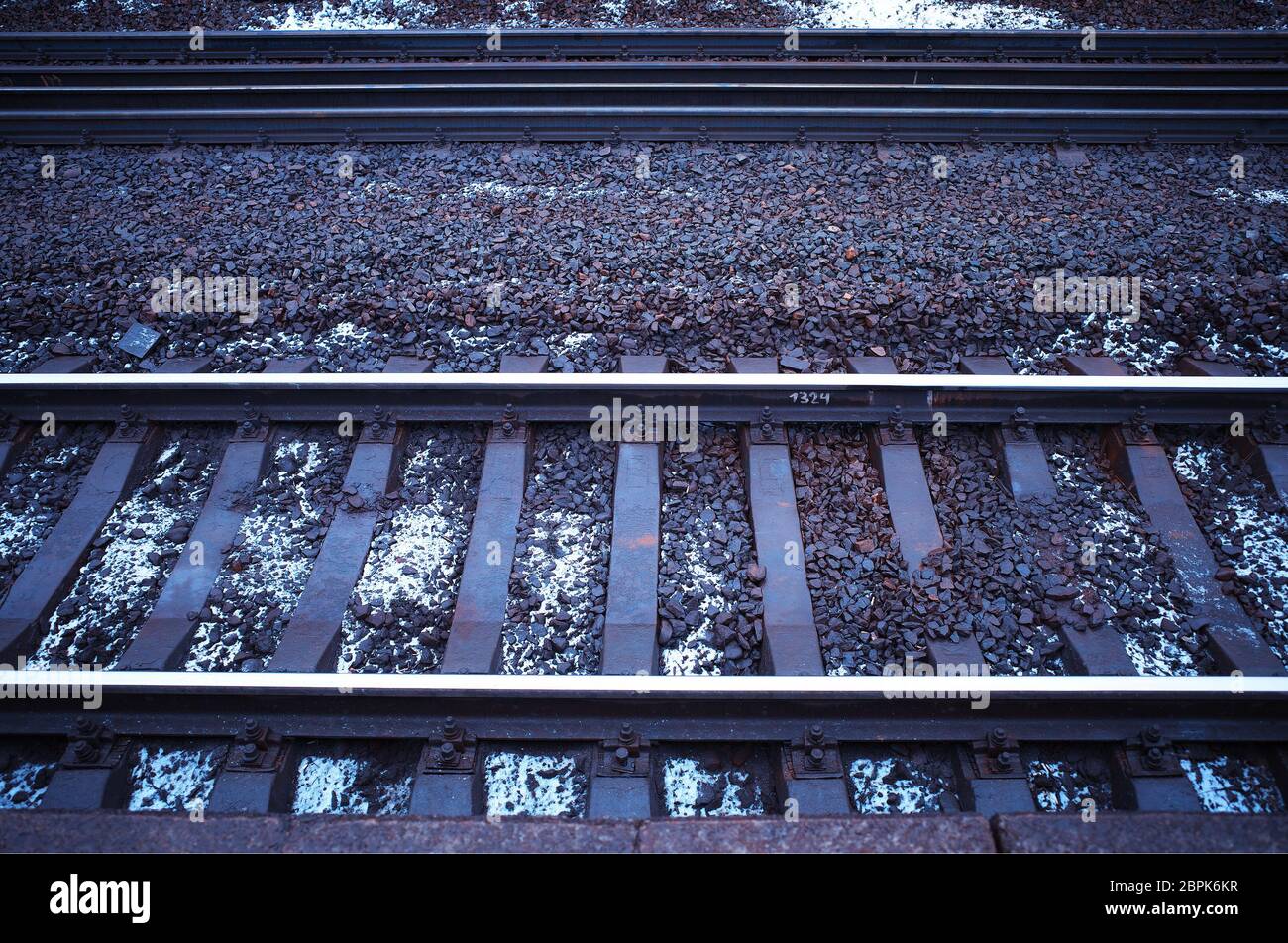 Empty railroad track with embankment backdrop Stock Photo - Alamy