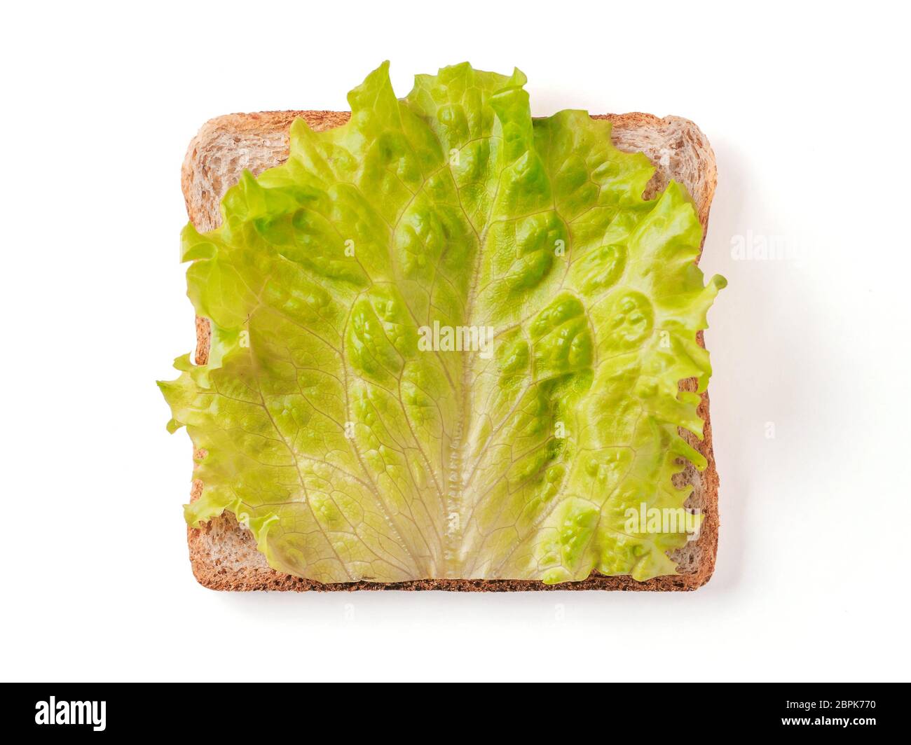 Bread slice with fresh salad leaf isolated on white, clipping path ...