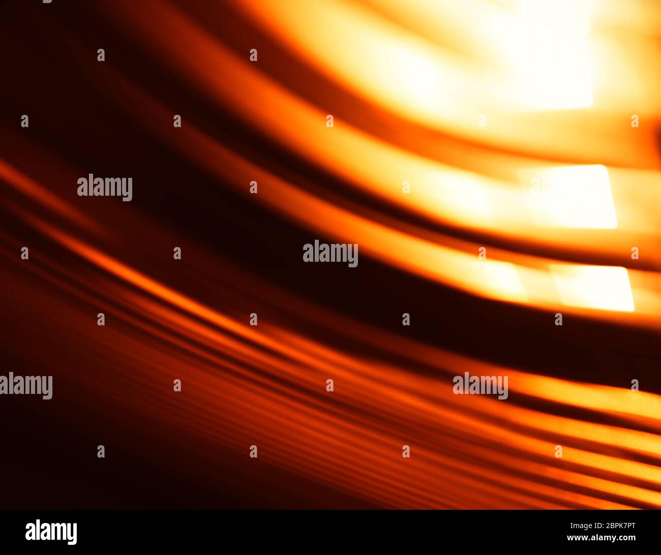 Orange metallic reflections texture background Stock Photo - Alamy