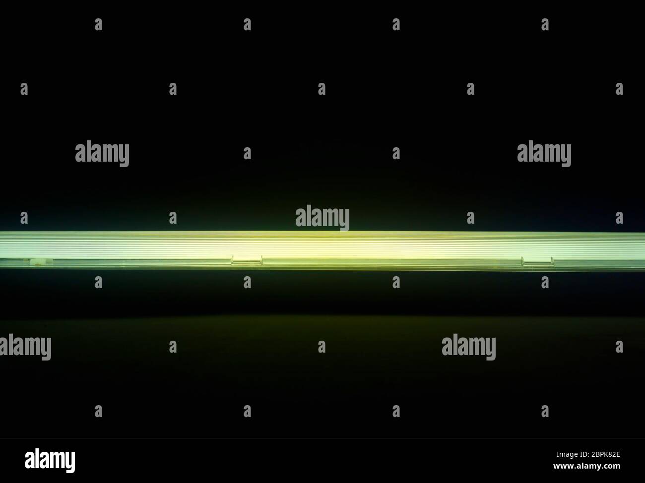 Dramatic green illuminated lamp background Stock Photo - Alamy