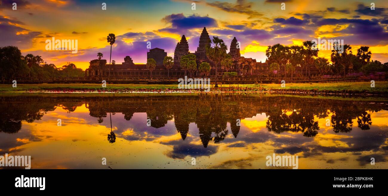 Angkor Wat temple reflecting in water of Lotus pond at sunrise. Siem ...
