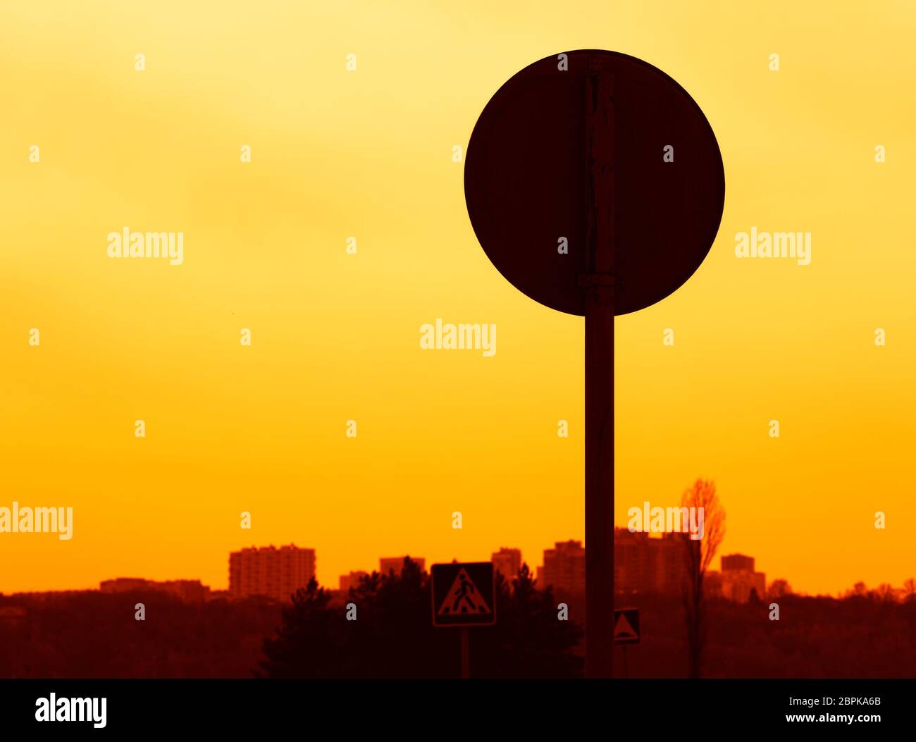 Sunset road sign: back view background Stock Photo - Alamy
