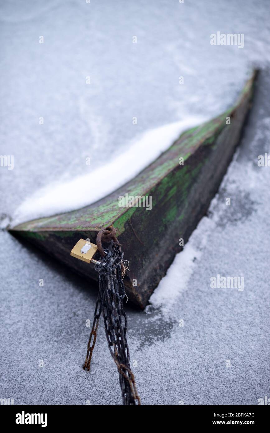 Boat frozen in ice at winter Stock Photo - Alamy