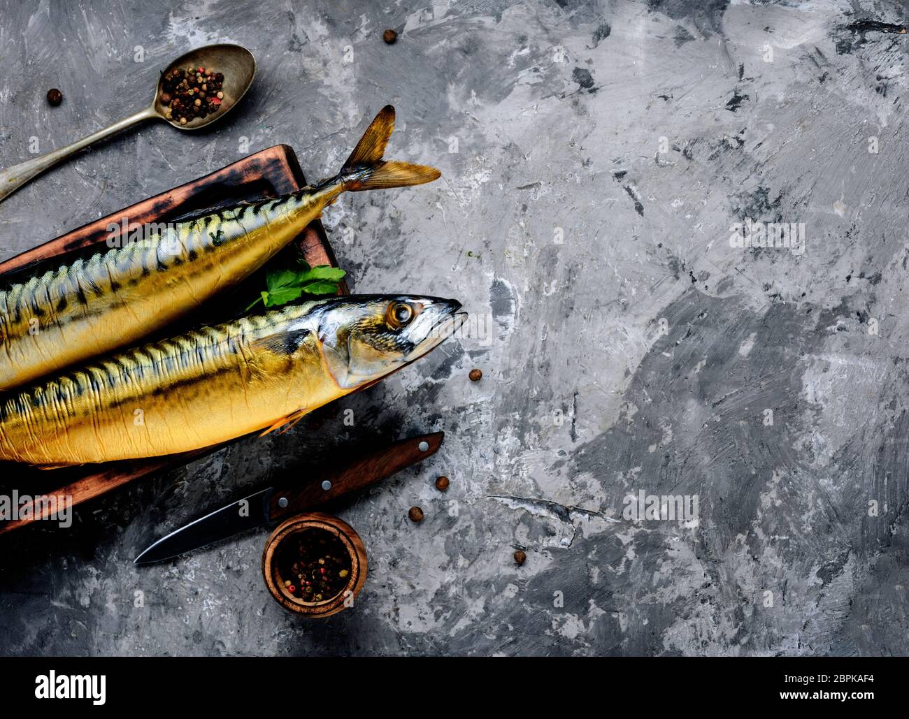 Smoked fish on kitchen board.Smoked mackerel.Mediterranean food Stock ...