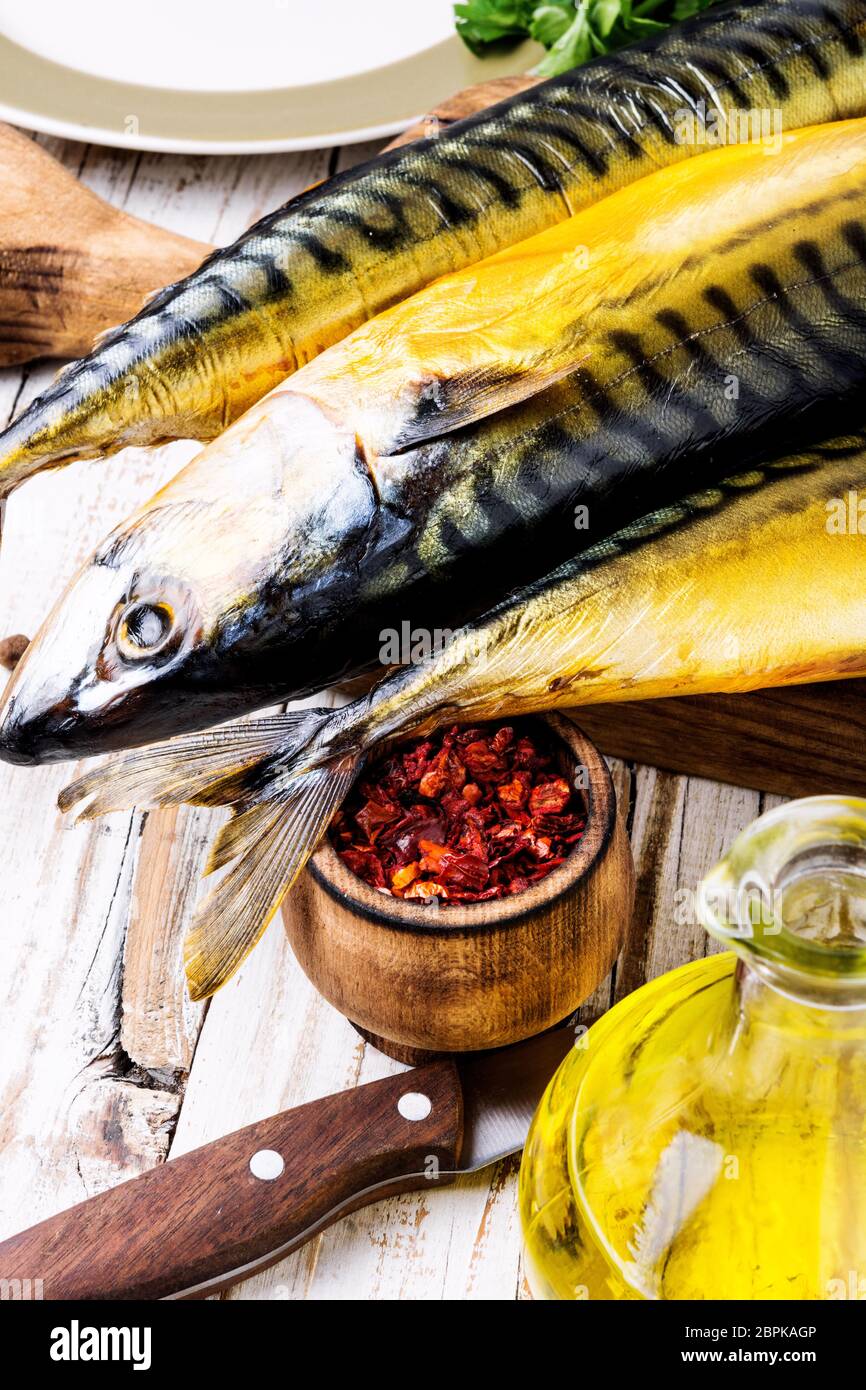 Smoked fish on kitchen board.Smoked mackerel.Mediterranean food Stock ...