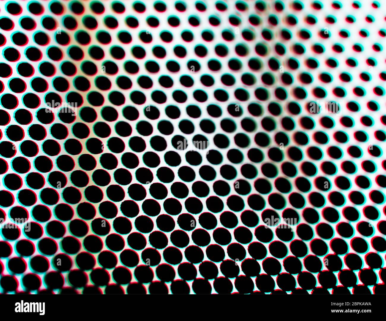 Perforated metal surface with chromatic aberration texture background ...