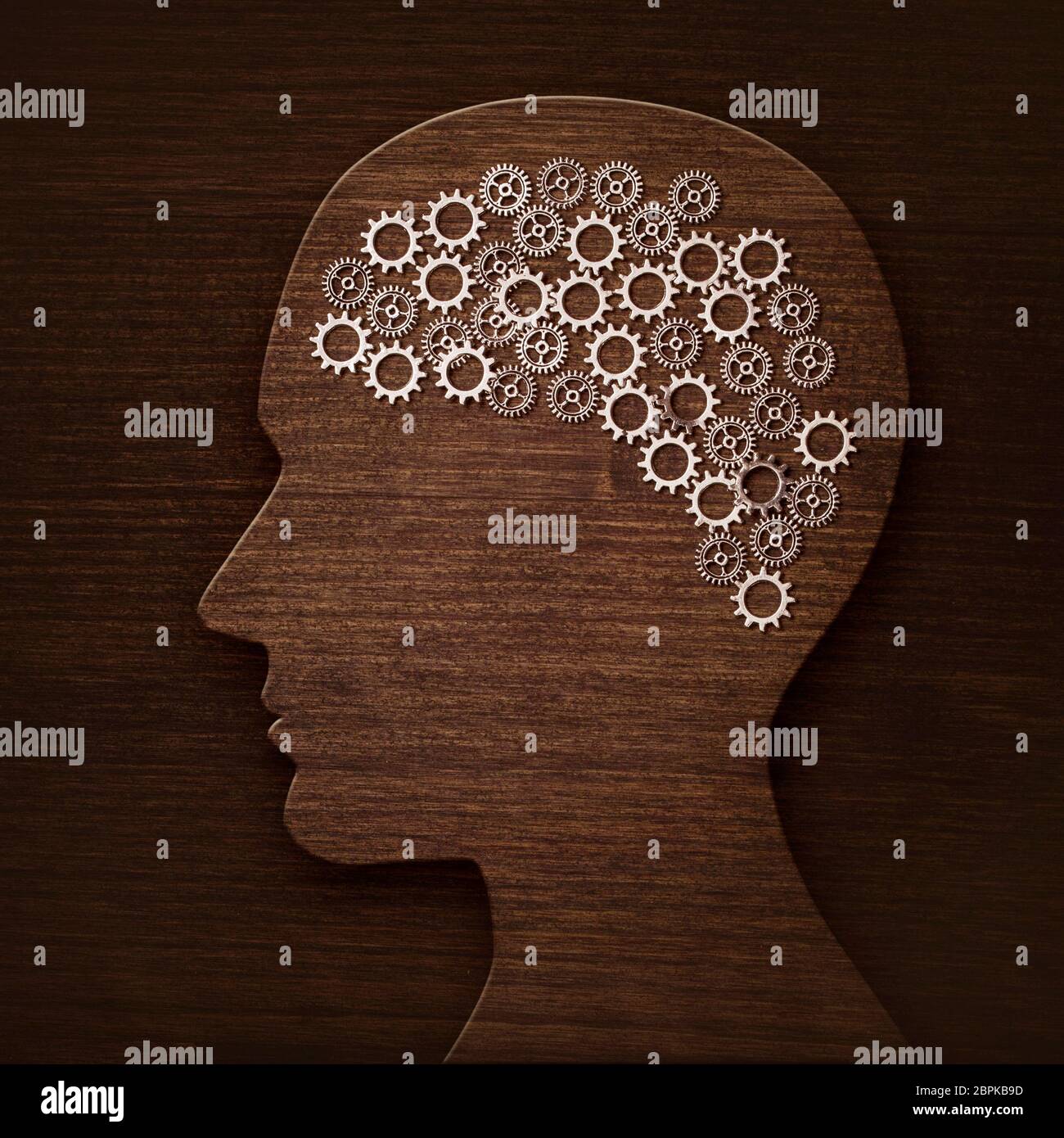 Brain concept made from gears and cogwheels, wooden background Stock ...