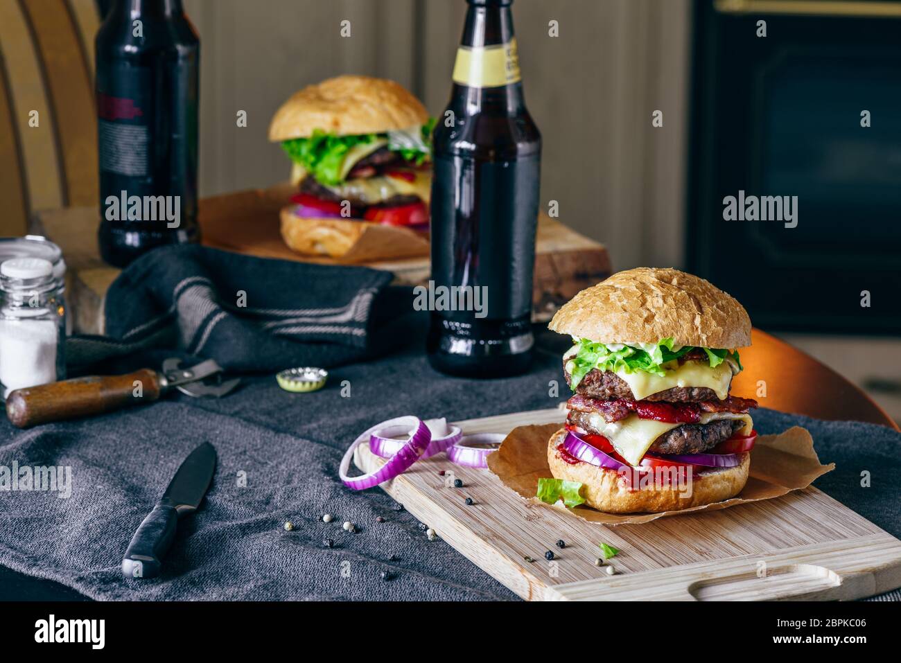 Dinner with Two Patties Cheeseburger and Couple Bottle of Beer on ...