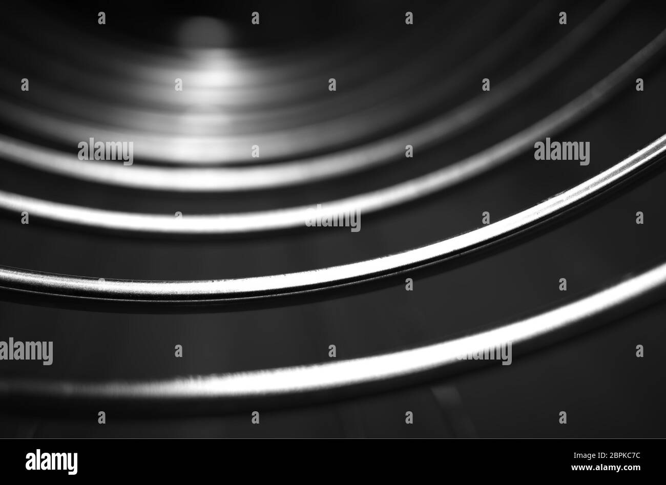 Metallic black and white curved pipes background Stock Photo - Alamy