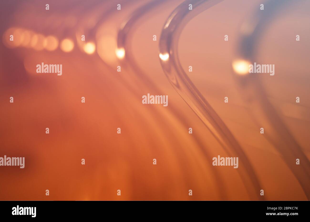 Metallic curved shapes during dramatic light leak Stock Photo - Alamy