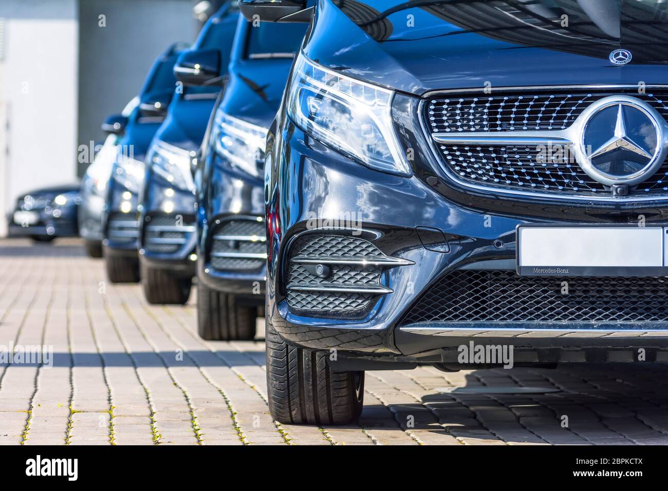 Black Mercedes-Benz V class, front view minivan in a row in a parking ...