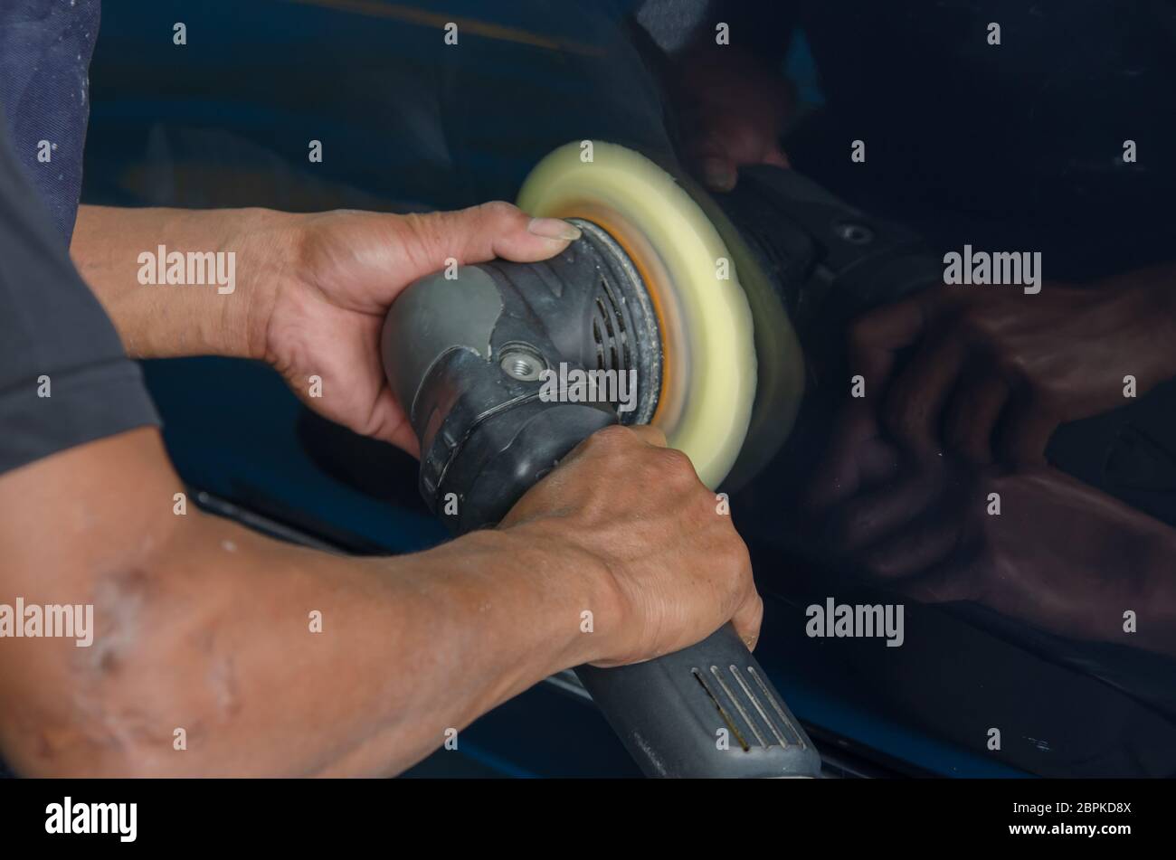 Man working for polishing, coating cars Stock Photo - Alamy