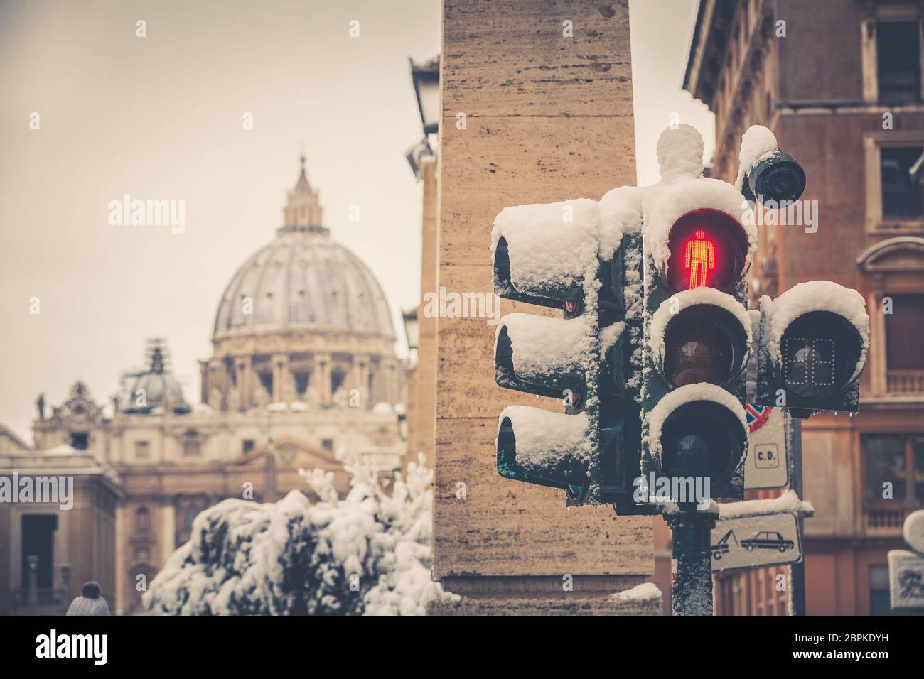 Traffic light covered with snow. Extraordinary climate event in Rome in ...