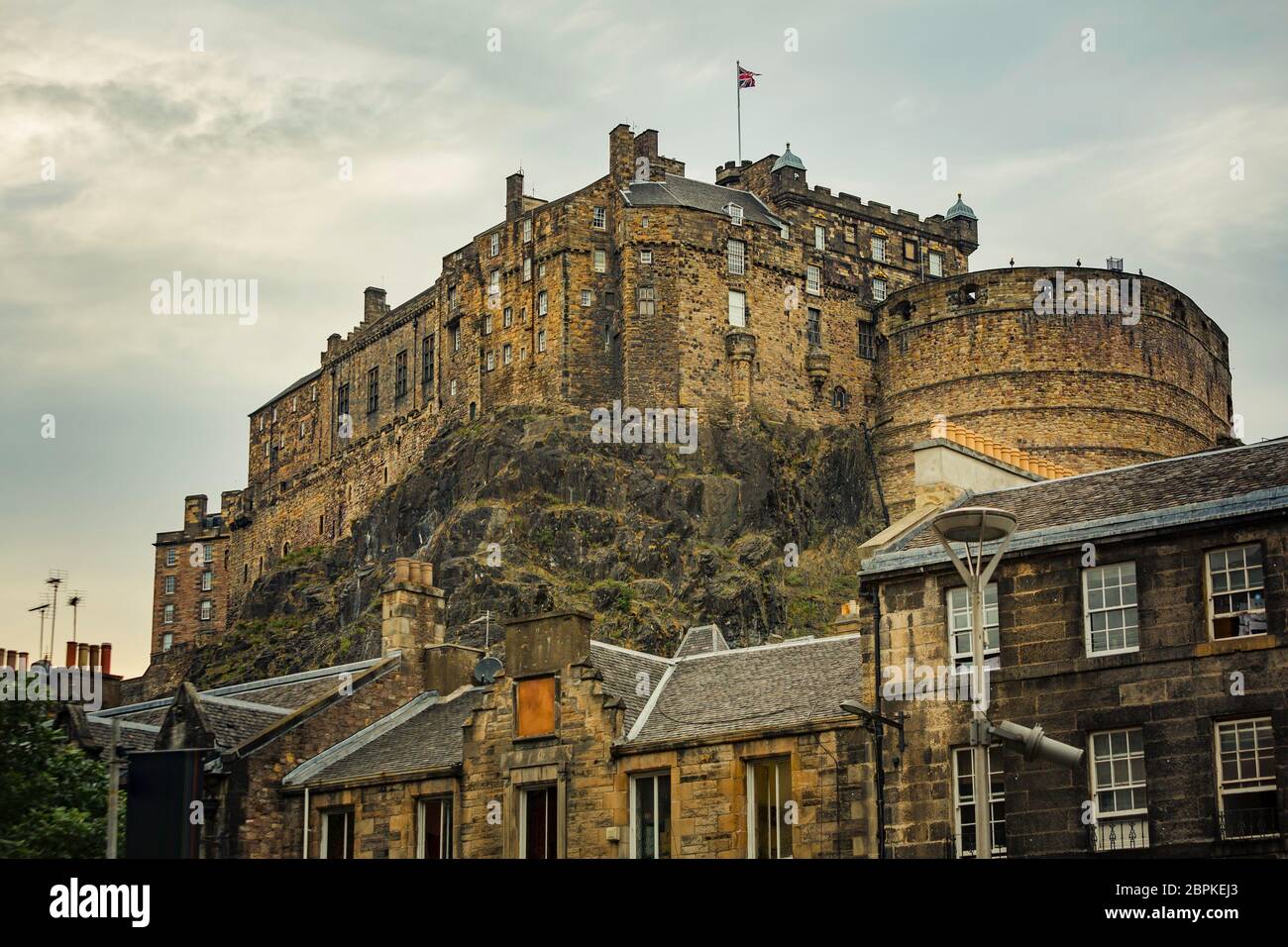 Edinburgh Castle on a cloudy day from street below Stock Photo - Alamy