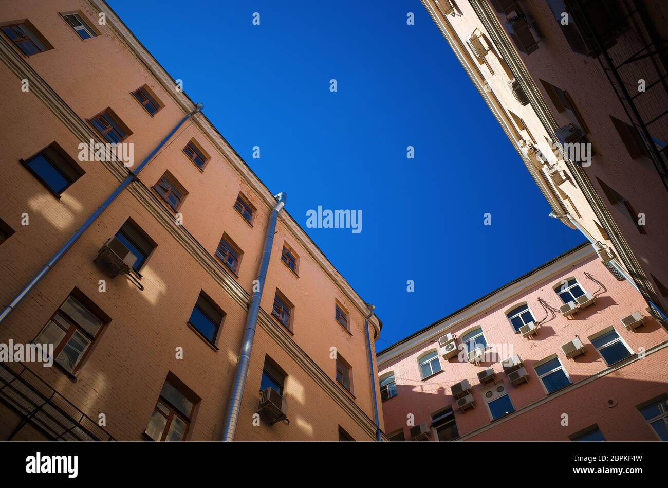 Diagonal buildings upward view background Stock Photo - Alamy