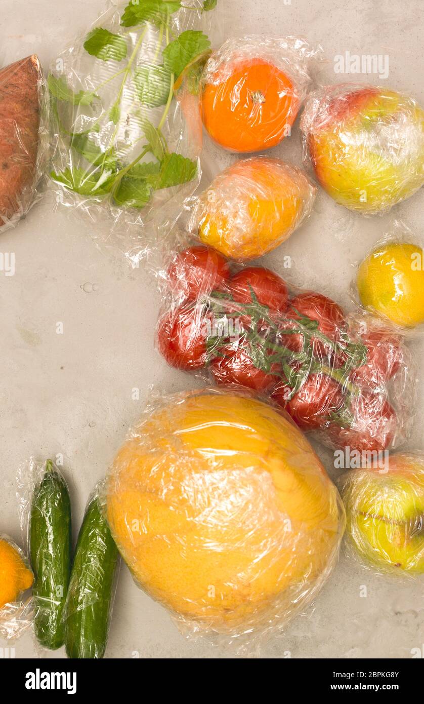many different fruits and vegetables are wrapped in plastic foil ...