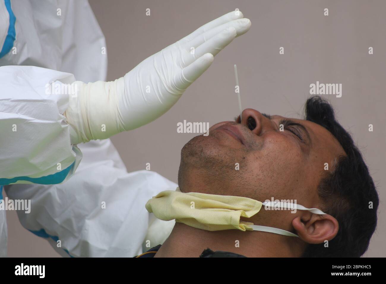 Kathmandu, Nepal. 19th May, 2020. A health worker collects a nose swab ...