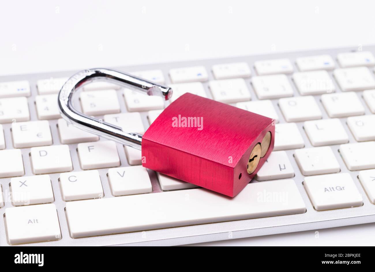 Red padlock on keyboard isolated on white background Stock Photo - Alamy