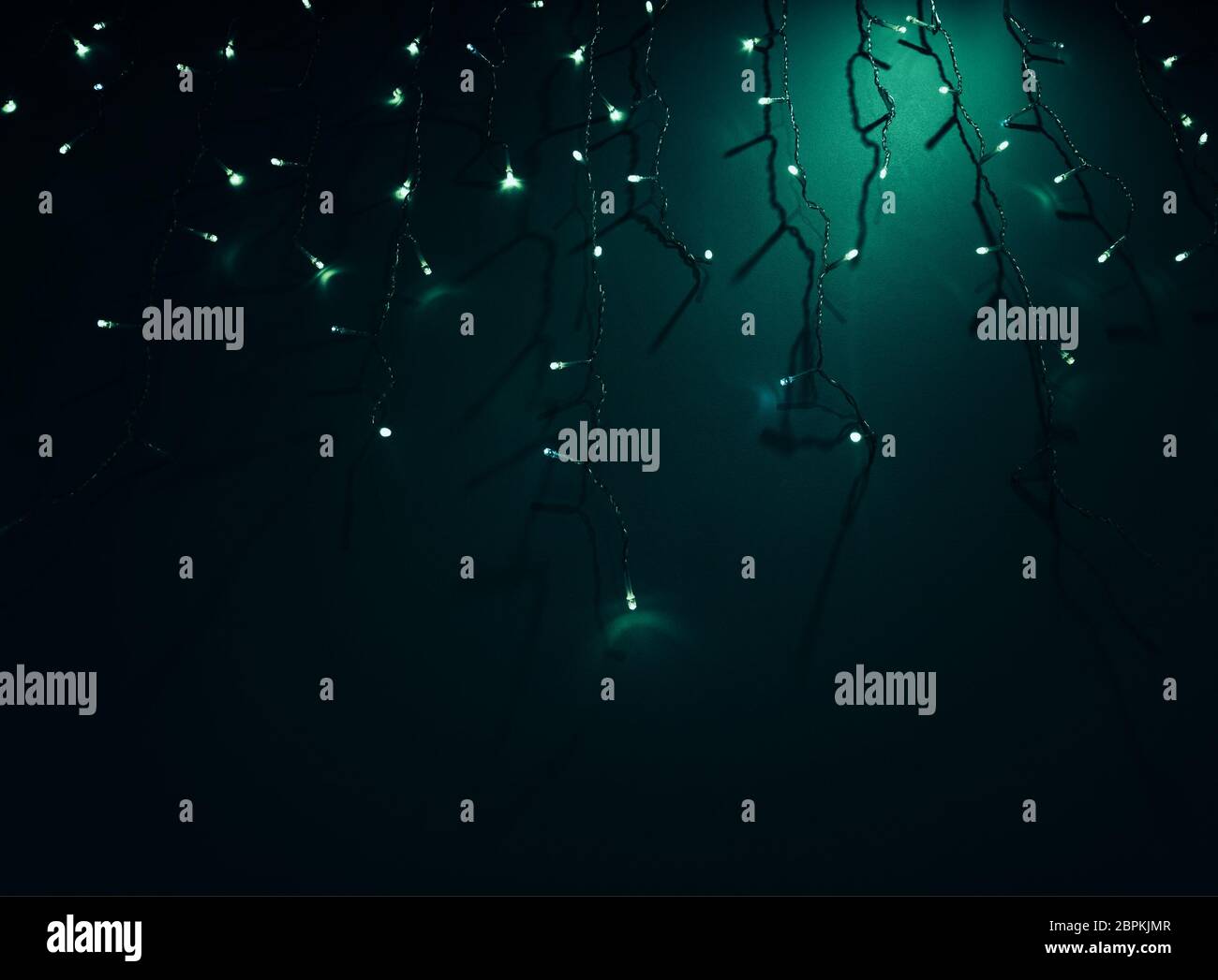 Dramatic led garland in dark room background Stock Photo - Alamy