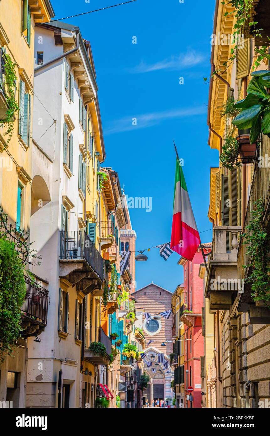 Typical italian street with traditional colorful buildings with shutter ...