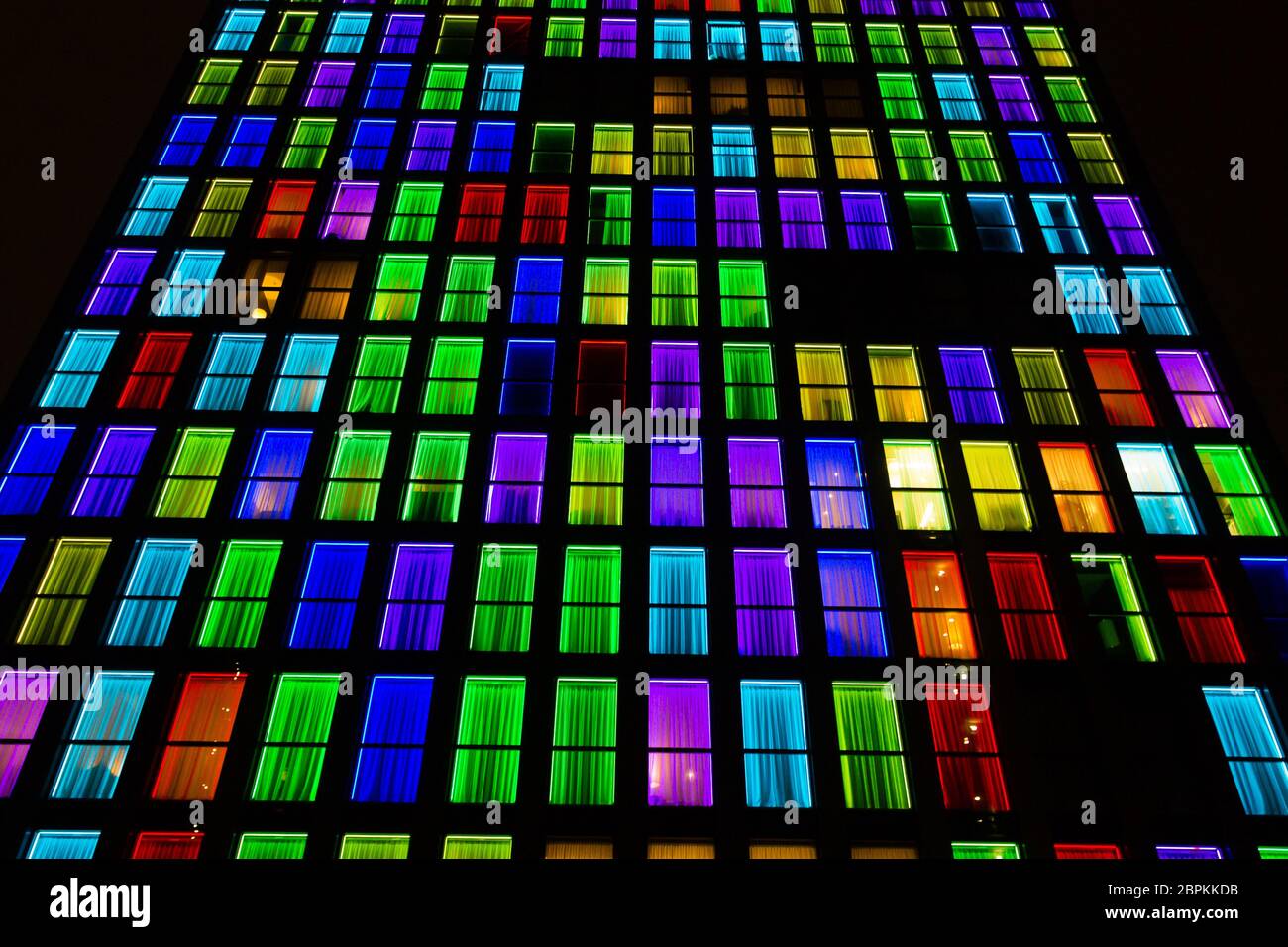 Colored windows texture. Windows illuminated by neon lights background ...