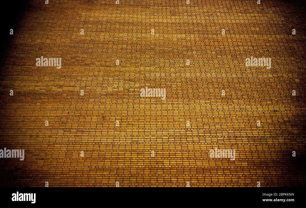 Sunset brick wall vignette background Stock Photo - Alamy