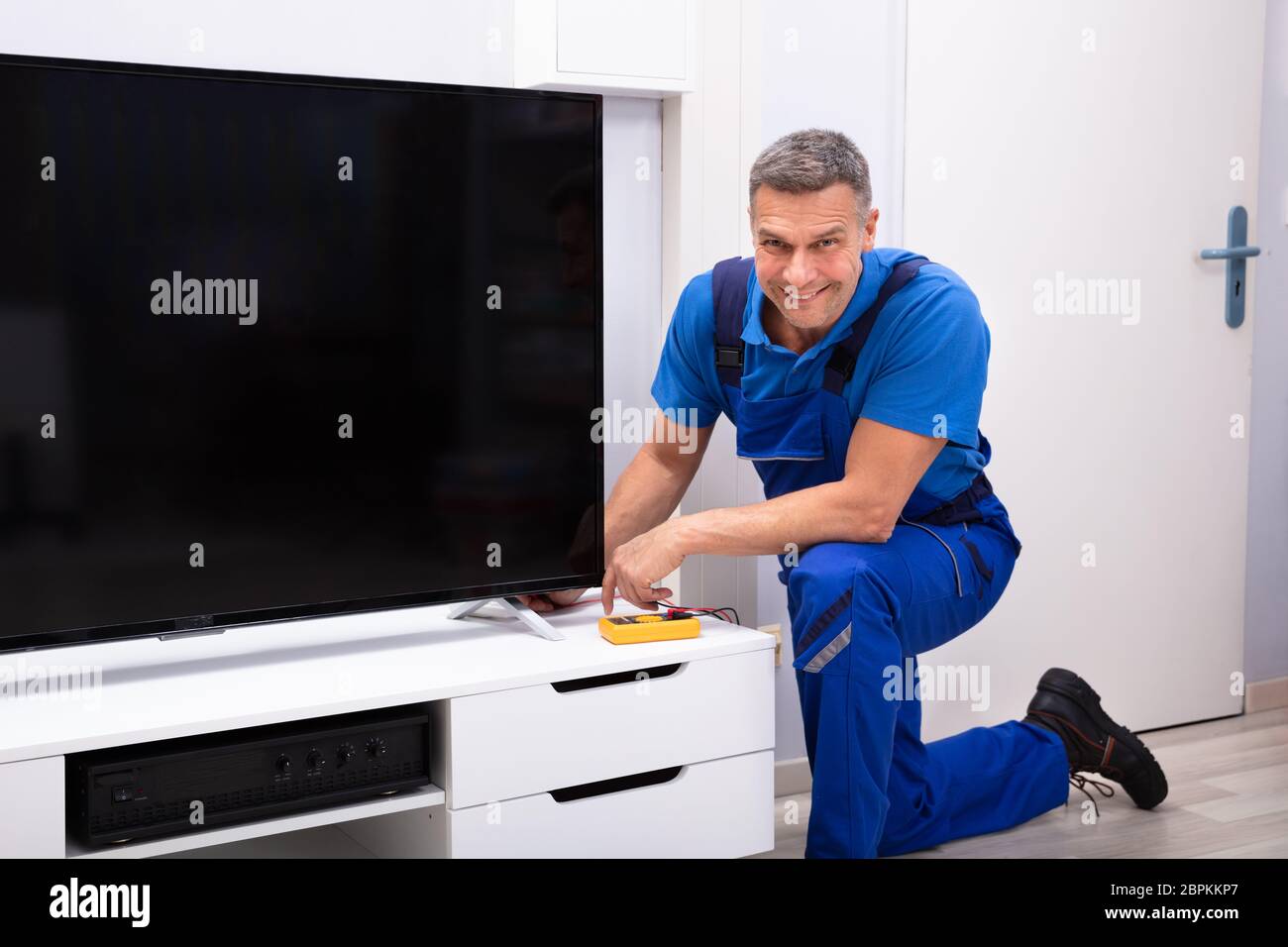 Old man television repairman hi-res stock photography and images - Alamy