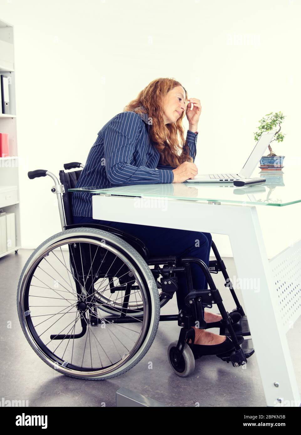 Female secretary wheelchair hi-res stock photography and images - Alamy