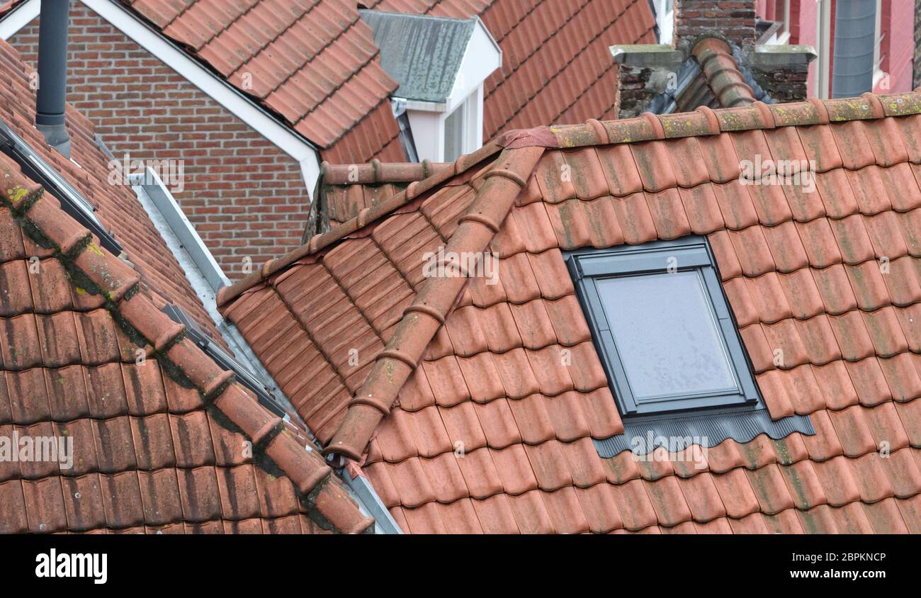 Close-up detail of a window installed in red roof background Stock ...