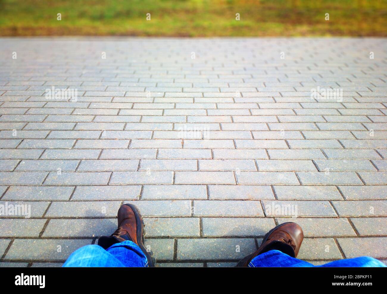 Bum is seating on the street background Stock Photo - Alamy