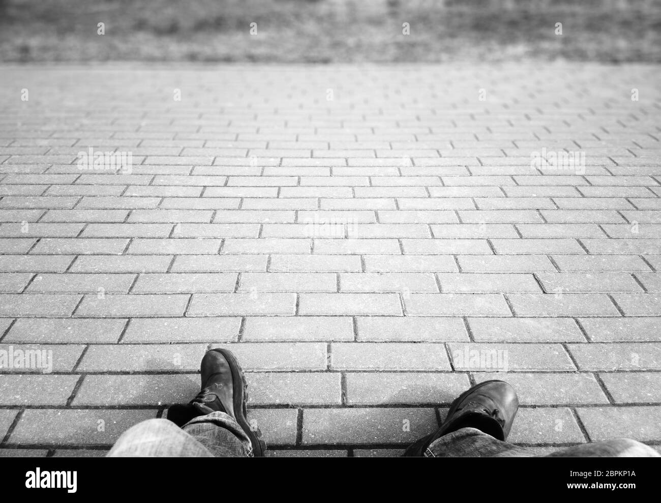 Black & white hobo is seating on the street background Stock Photo - Alamy