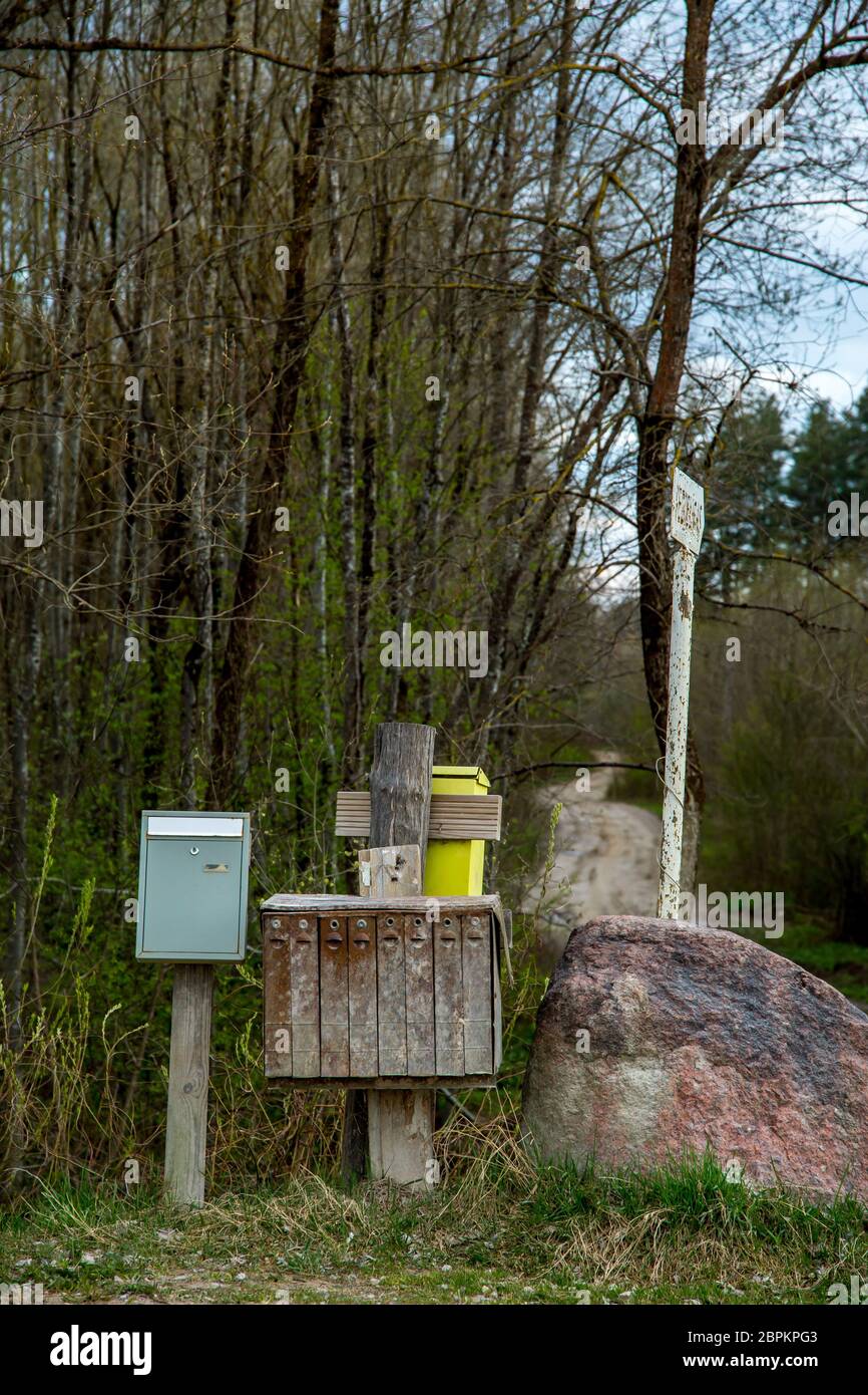 Spring landscape with rural mailbox. Old mailbox at rural roadside next ...