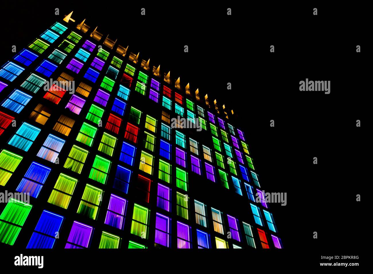 Colored windows texture. Windows illuminated by neon lights background ...