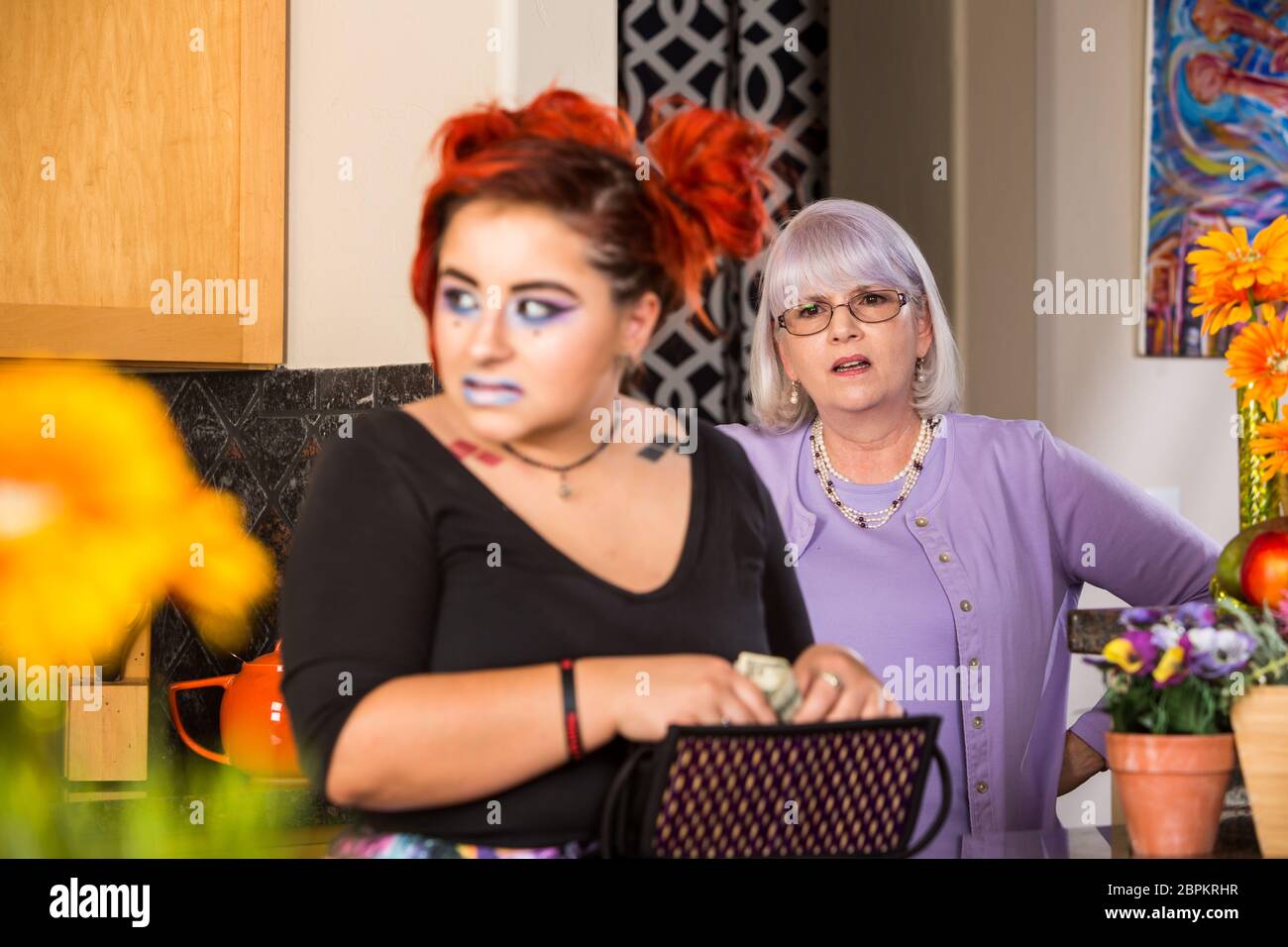 Mother stares in shock and sadness as her child steals money Stock ...