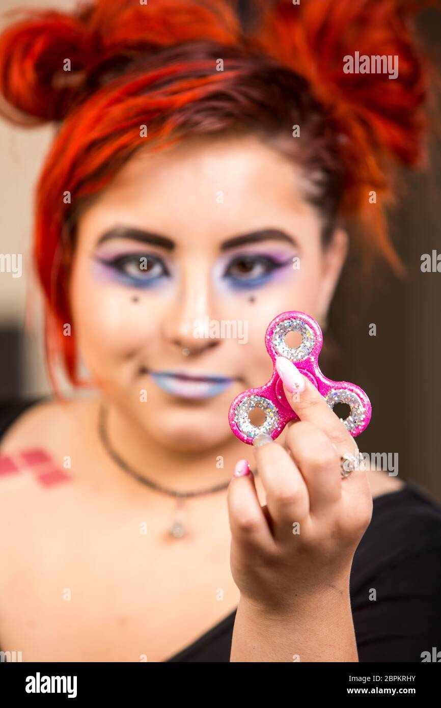 Spinning a fidget spinner hi-res stock photography and images - Alamy