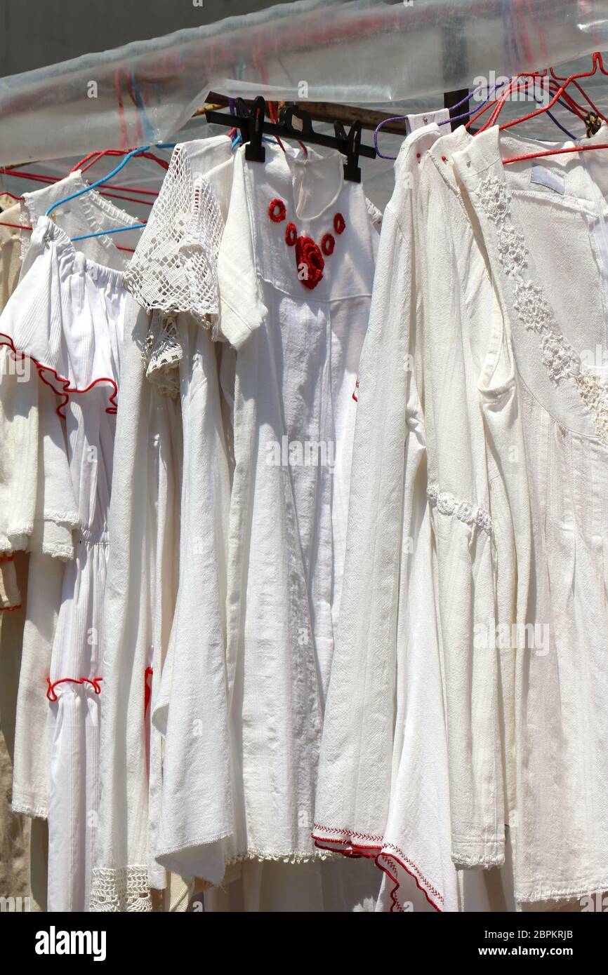 Traditional white cotton dresses sold on local agricultural fair Stock ...