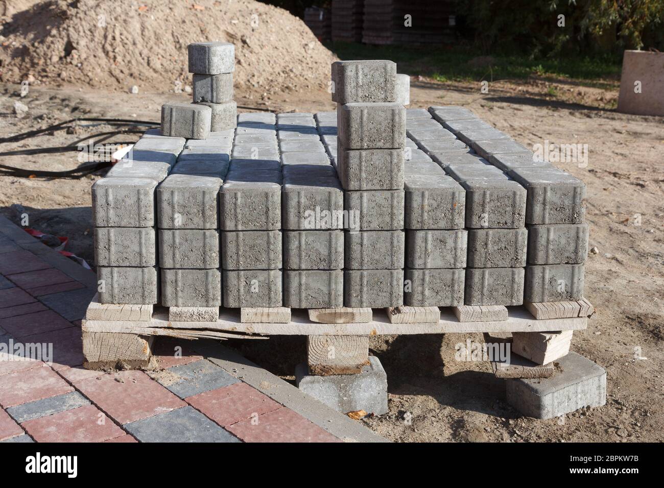 Brick tiles stacked on a pallet in construction site Stock Photo - Alamy
