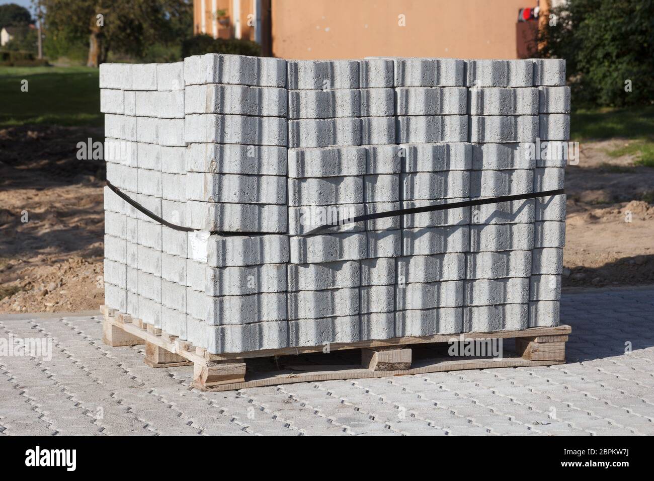 Brick tiles stacked on a pallet in construction site Stock Photo - Alamy