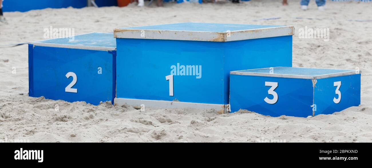 Winner, podium in the sand, sporting on the beach Stock Photo - Alamy