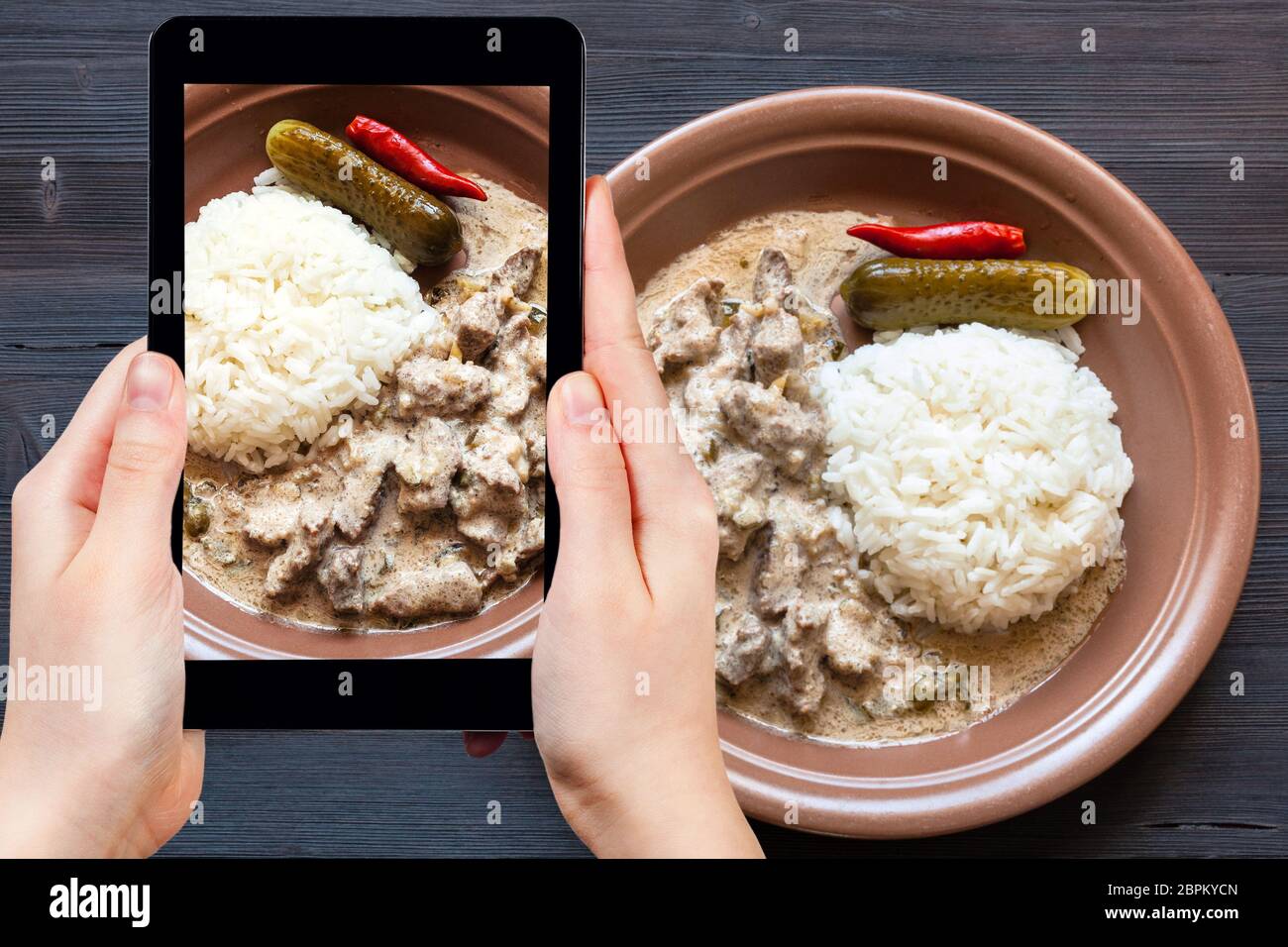 travel concept - visitor photographs of Russian cuisine dish of Beef ...