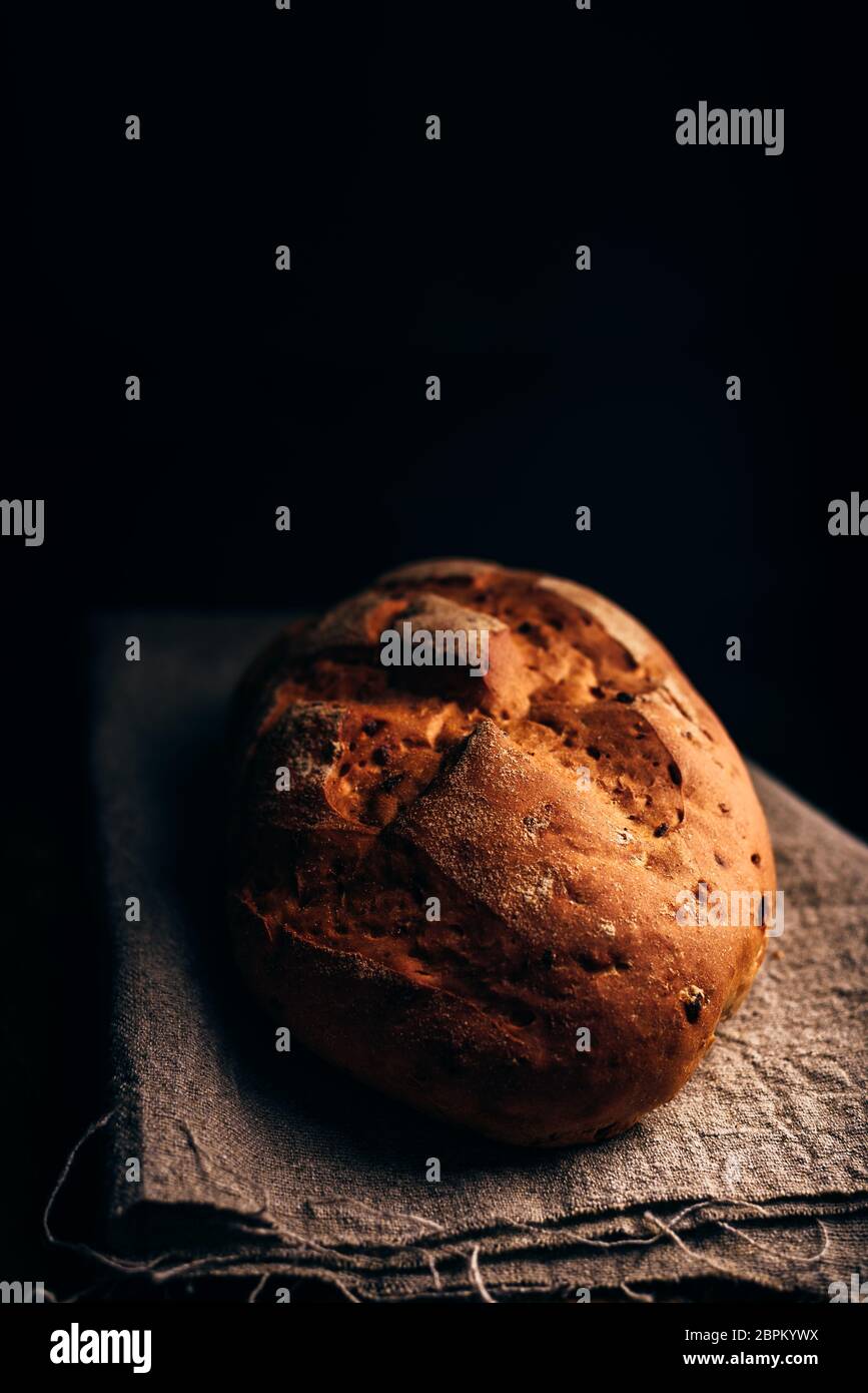 Loaf of Bread on Grey Cloth. Dark Background and Copy Space on the Top ...