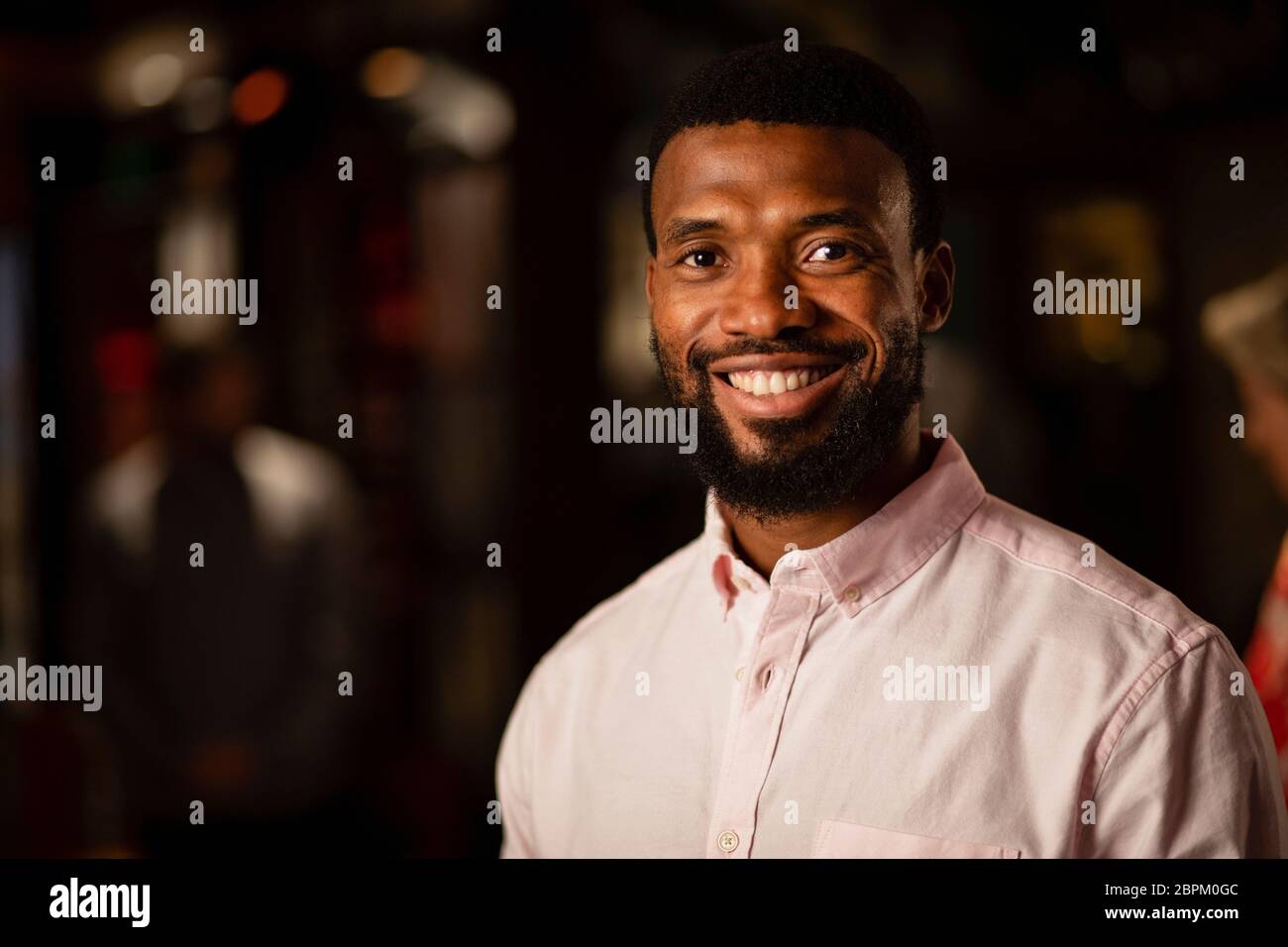 Headshot of a mid adult man smiling and looking at the camera Stock ...