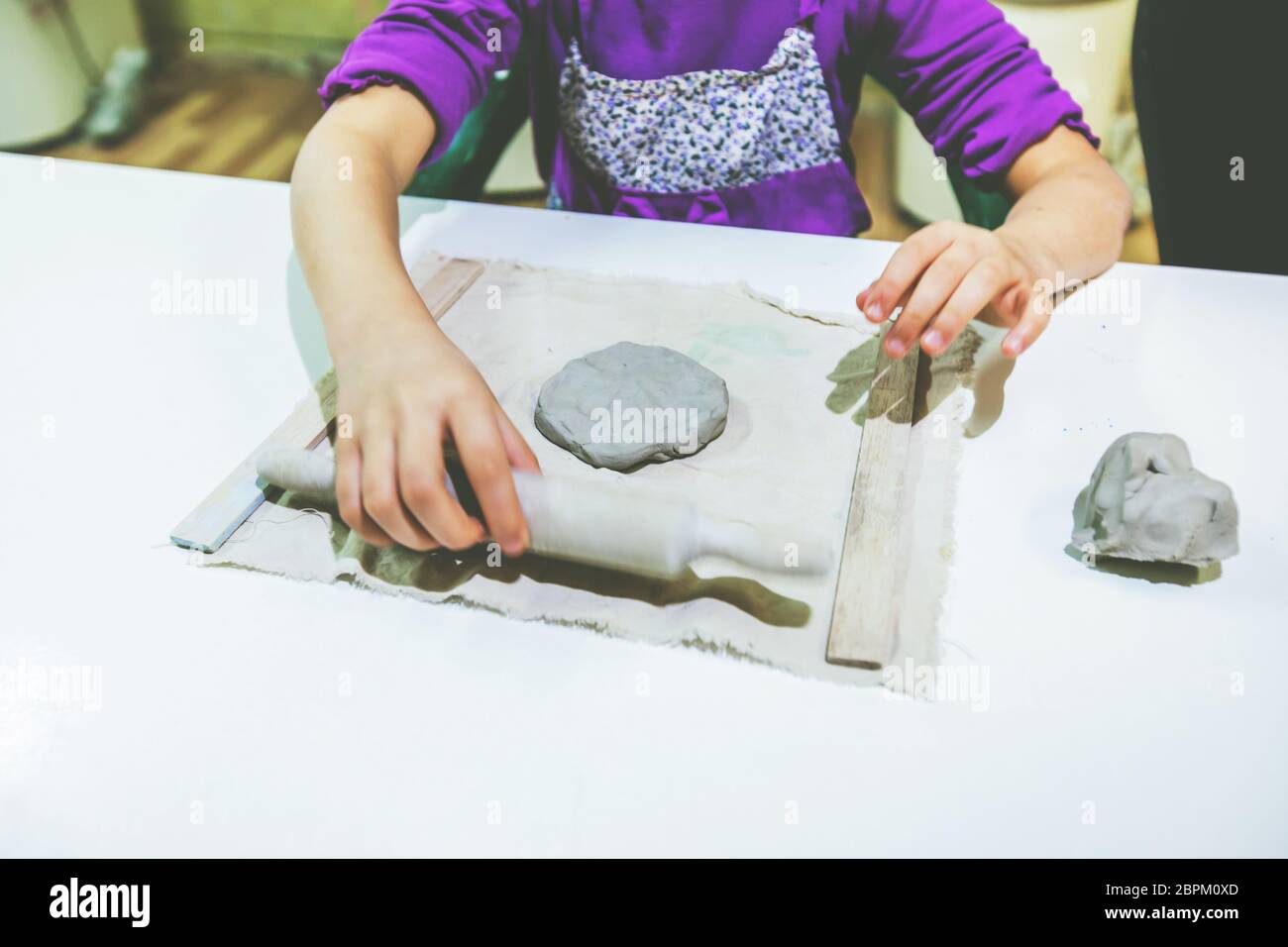 Creative children working with clay at pottery workshop Stock Photo - Alamy