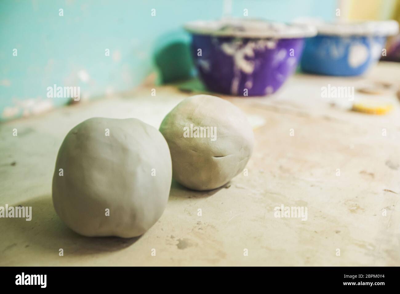 Clay on table at pottery workshop ready for molding Stock Photo - Alamy