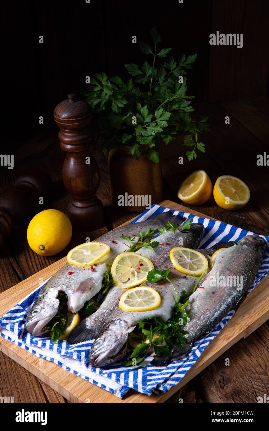 fresh trout with lemon and different herbs Stock Photo - Alamy